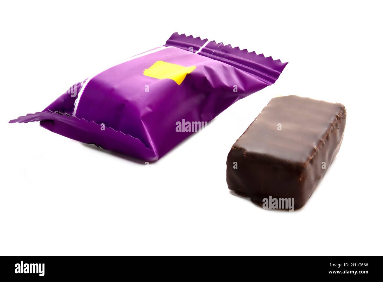 Chocolate candy in a wrapper and without isolated on white background ...