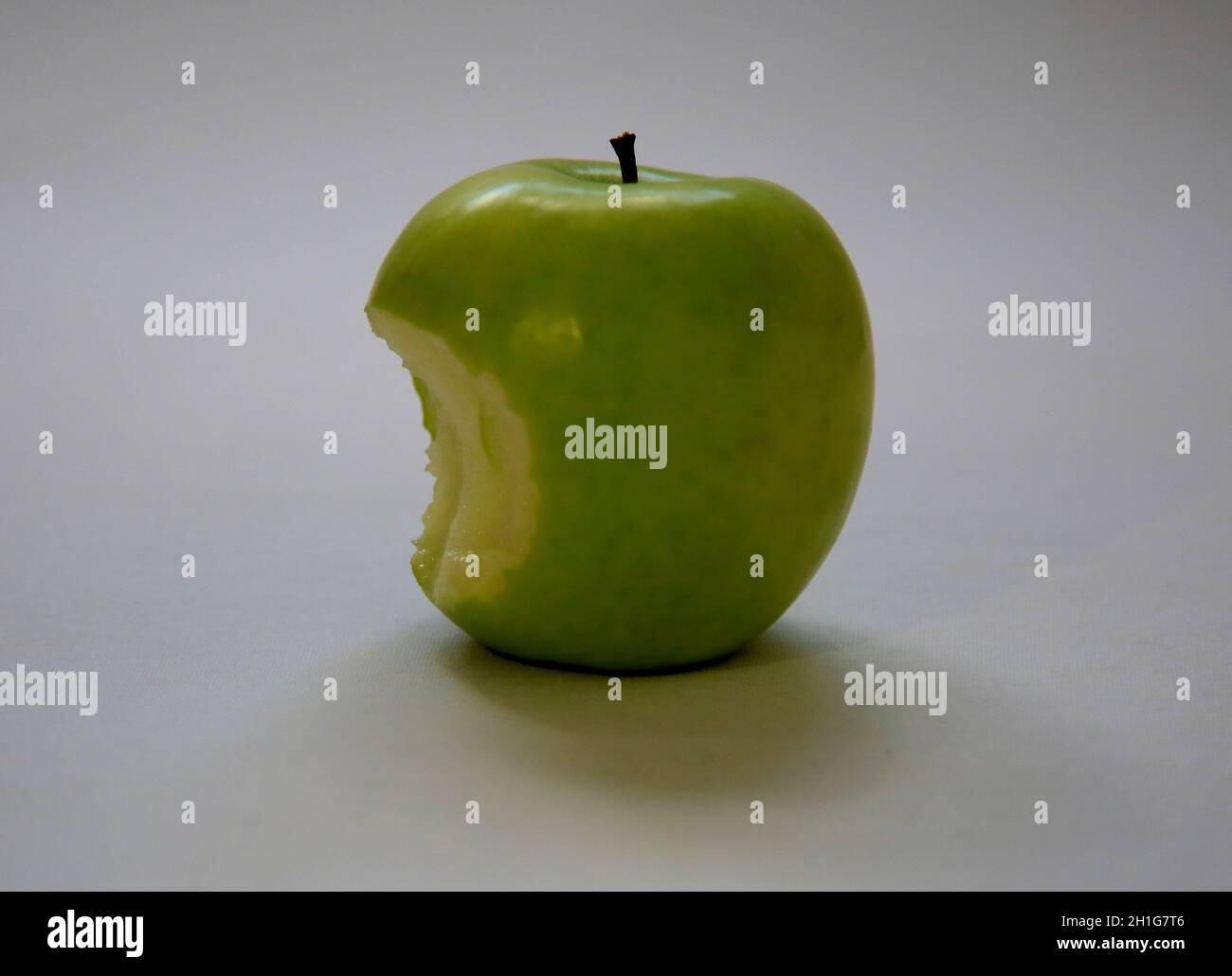 salvador, bahia / brazil - june 29, 2020: bitten green apple fruit is ...