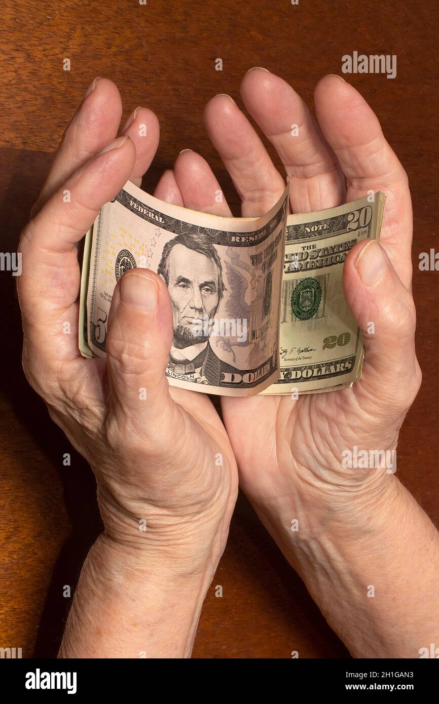 Senior person and cash and fan hi-res stock photography and images - Alamy