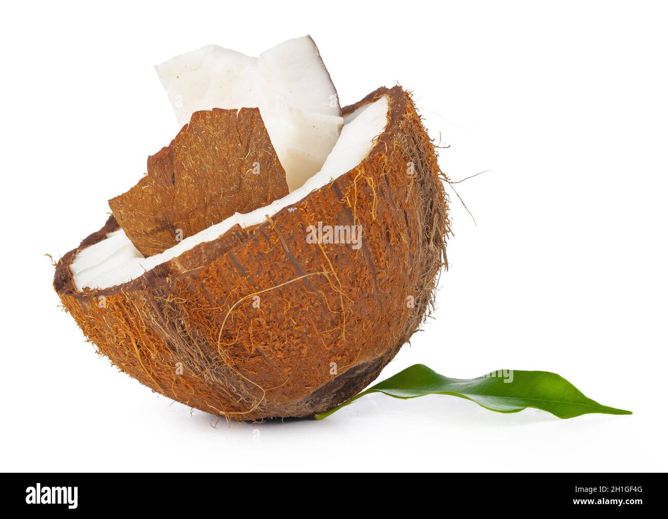 Cracked coconut with leaves isolated on white background Stock Photo ...