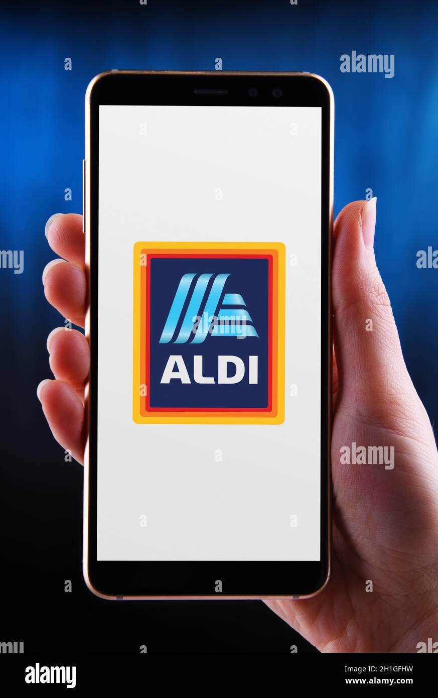 POZNAN, POL - MAY 21, 2020: Hands holding smartphone displaying logo of ...