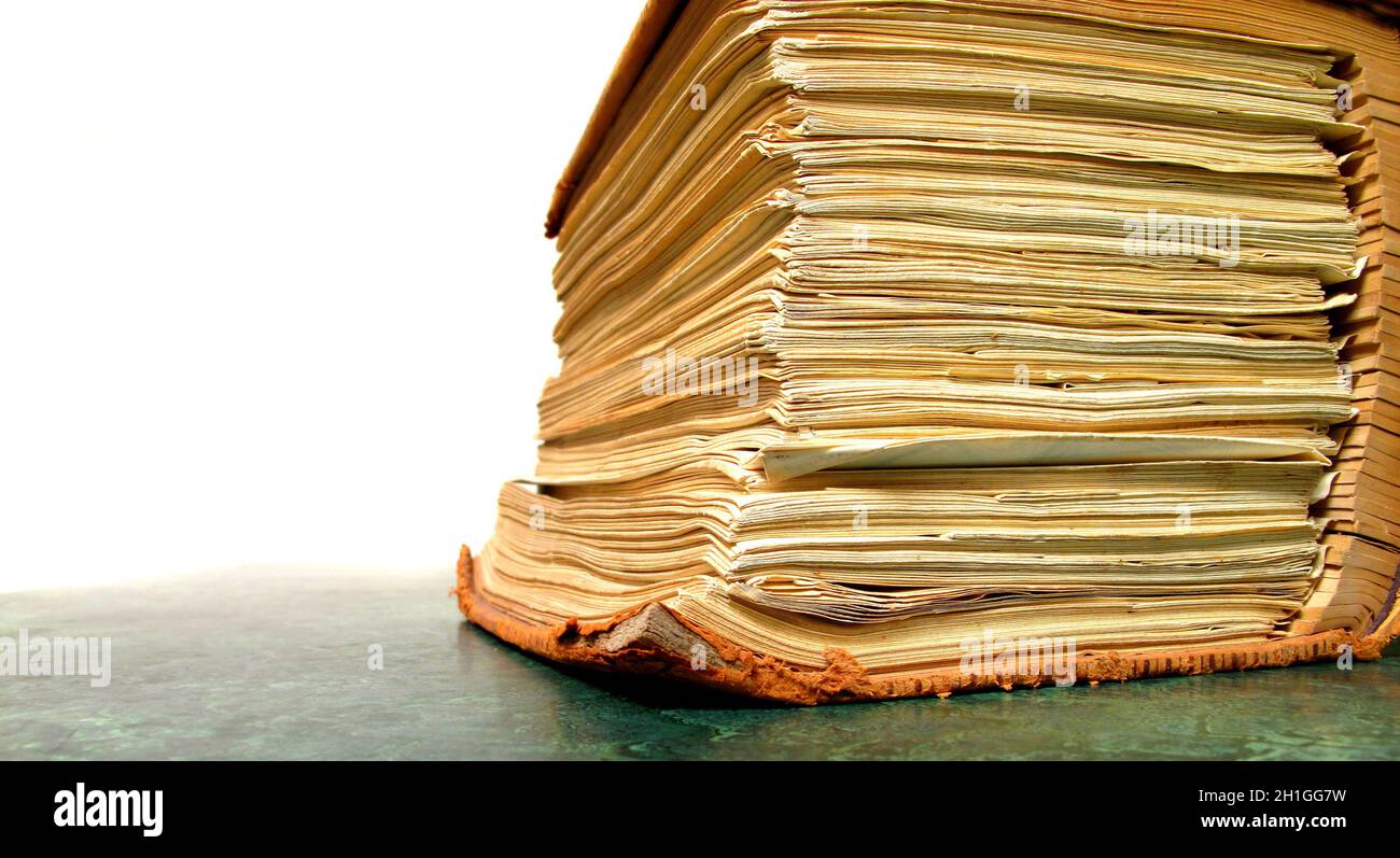 Ancient old book on desk with worn out pages for learning education or ...