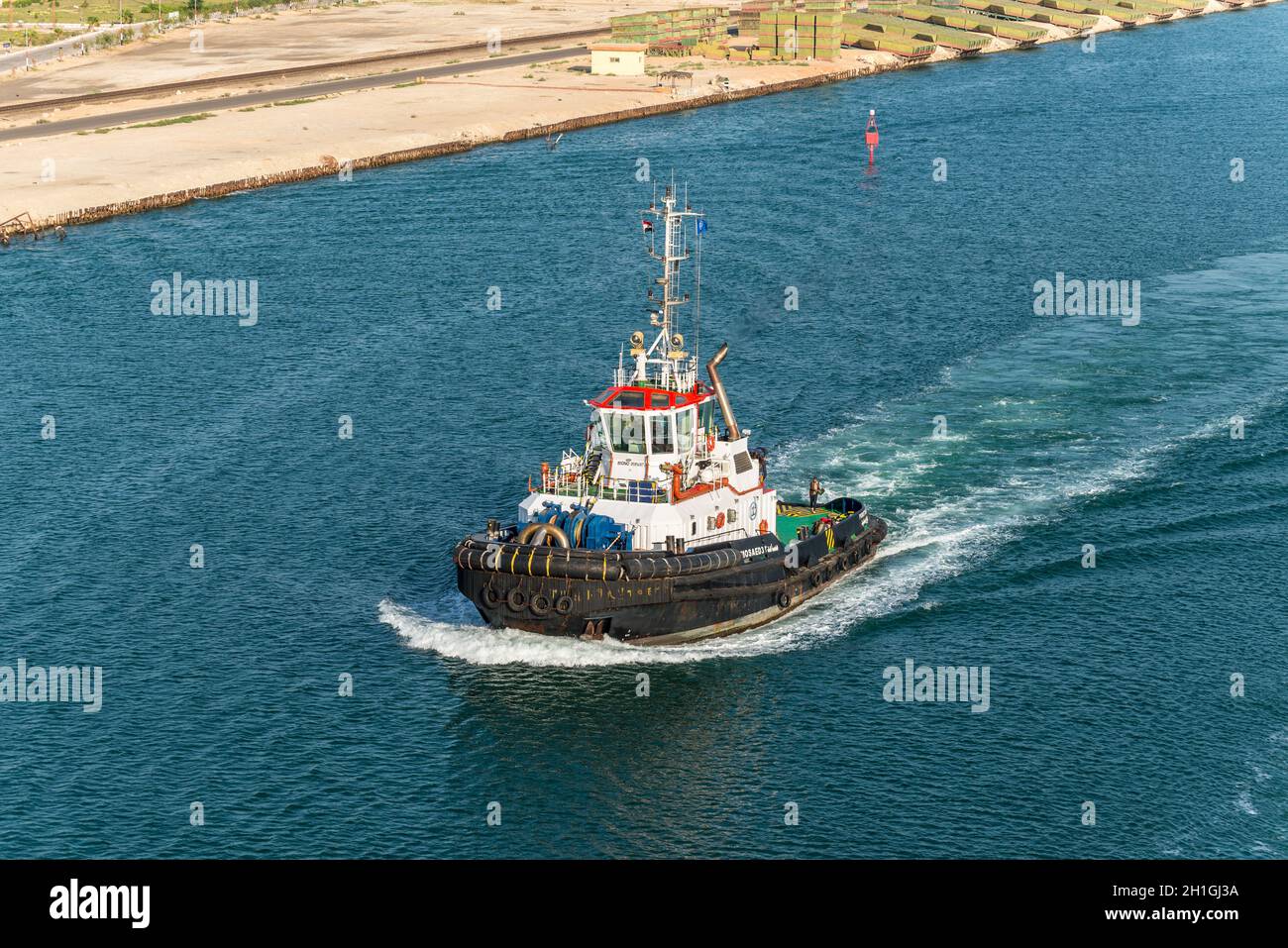 El Qantara, Egypt - November 14, 2019: Tugboat accompanies the ships ...