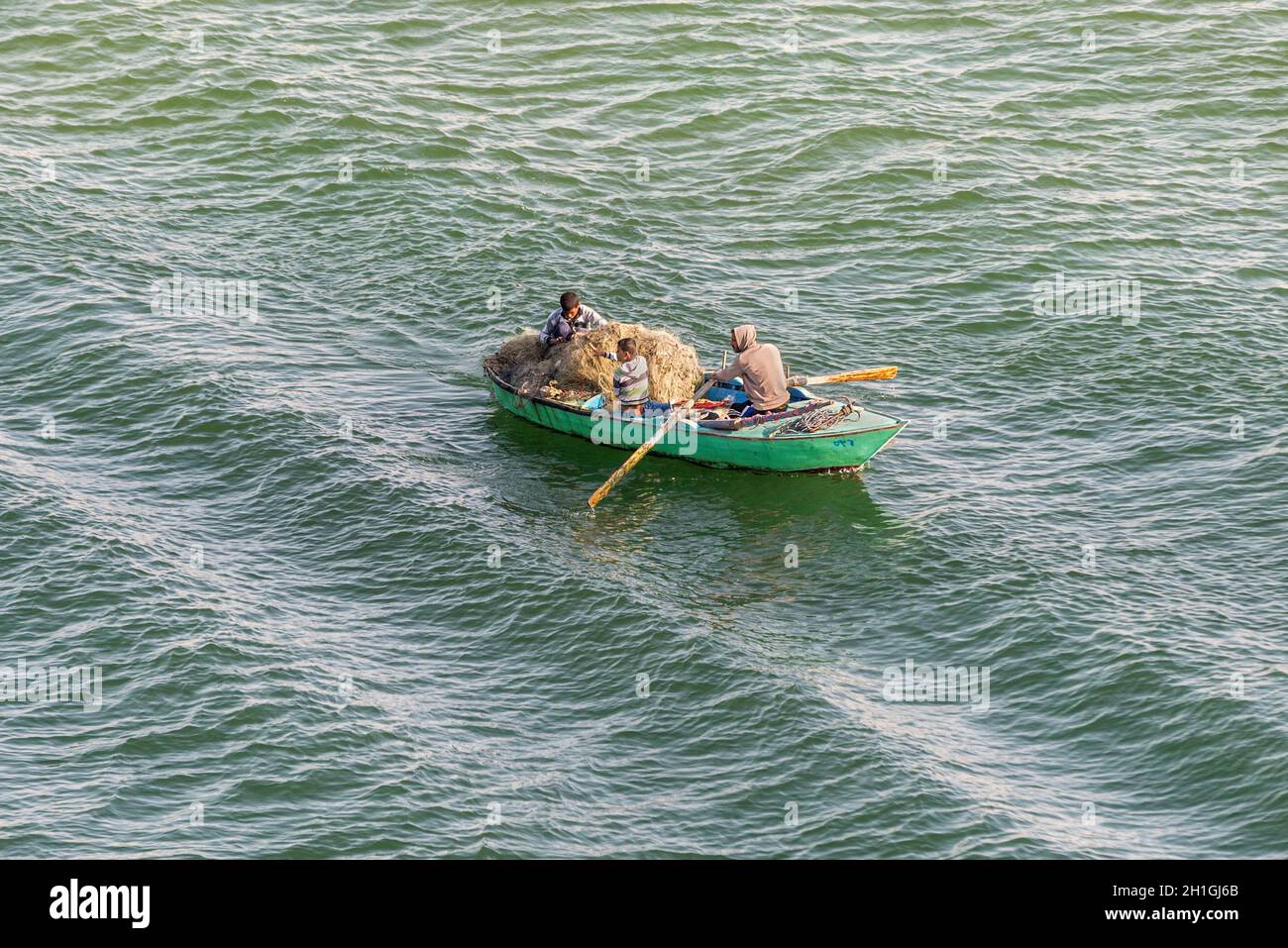 El Qantara, Egypt - November 14, 2019: Fishermen in wooden boat on the ...