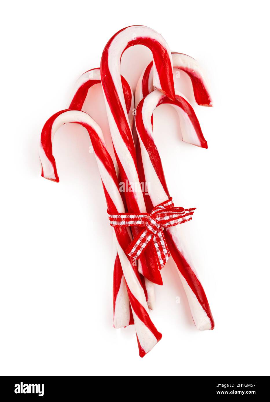 Stack of candy canes isolated on white background Stock Photo - Alamy