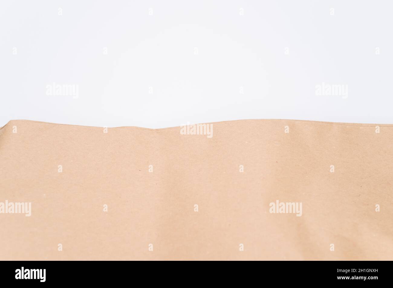 recycled brown Kraft paper folded on white background Stock Photo - Alamy