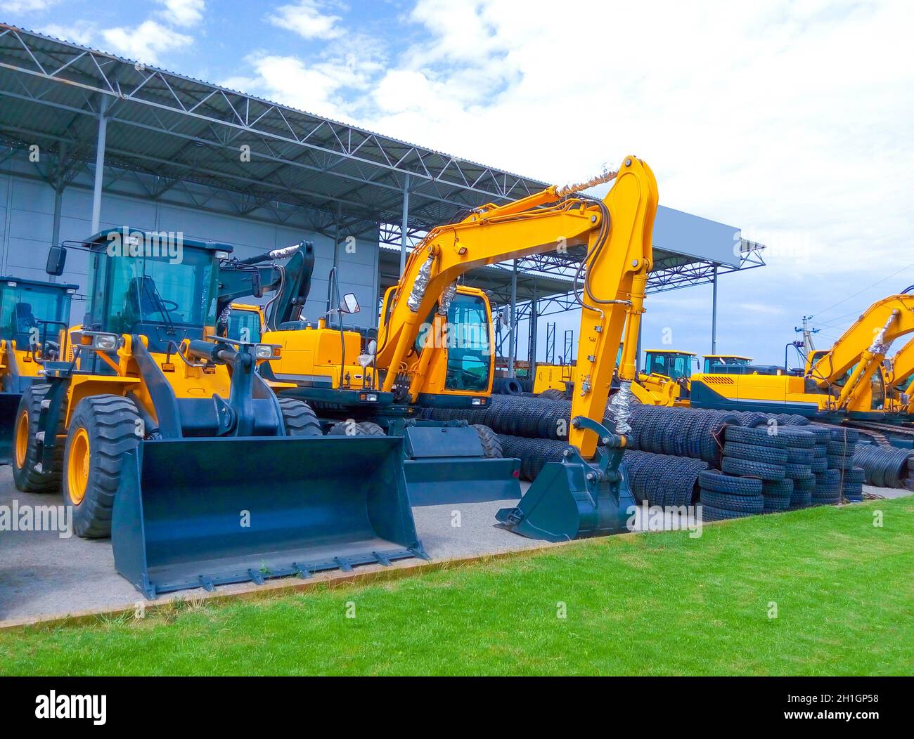 Modern excavators at Kyiv, Ukraine. The new bulldozers on road. The ...