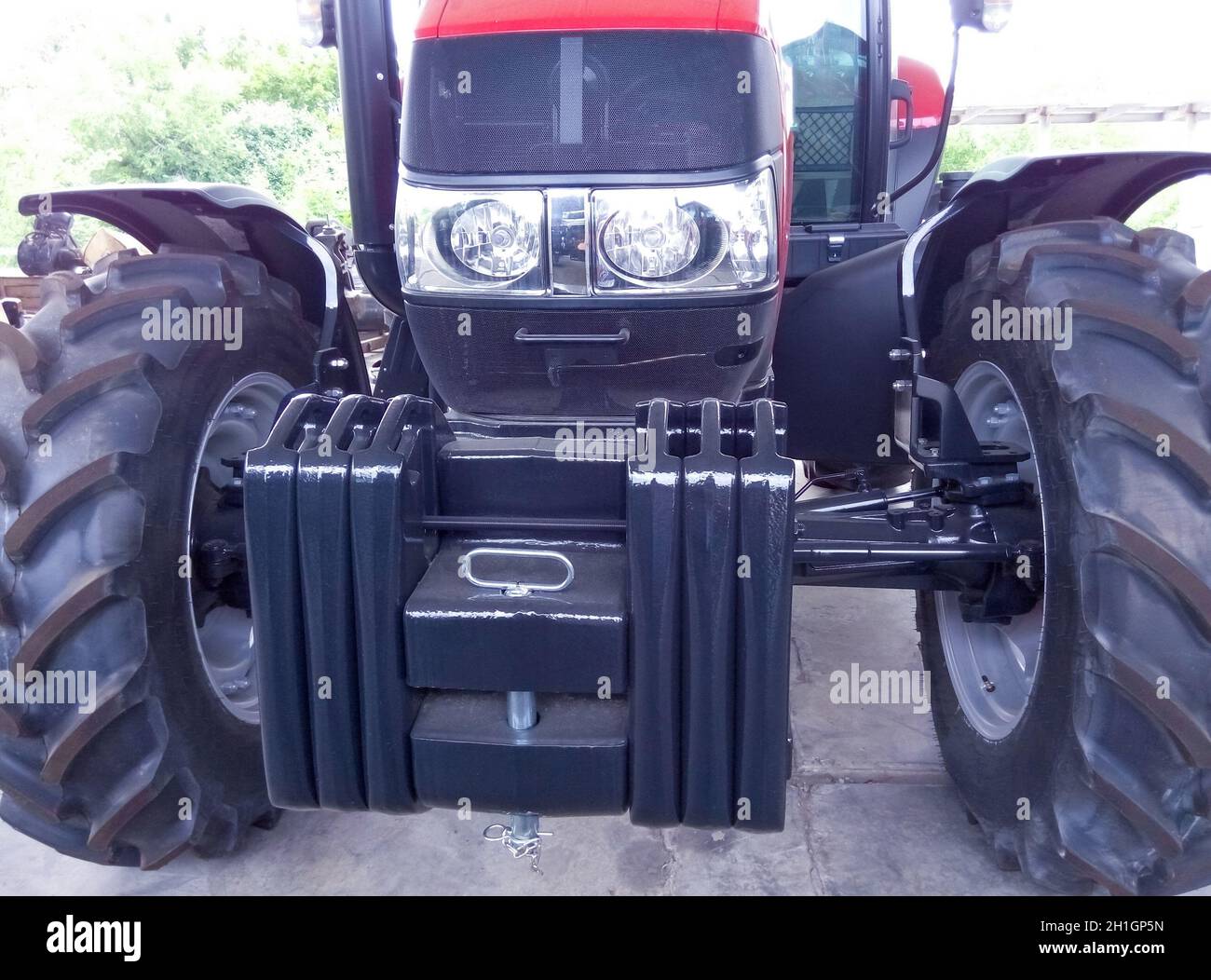The colorful red tractors. The agriculture, farming concept Stock Photo ...