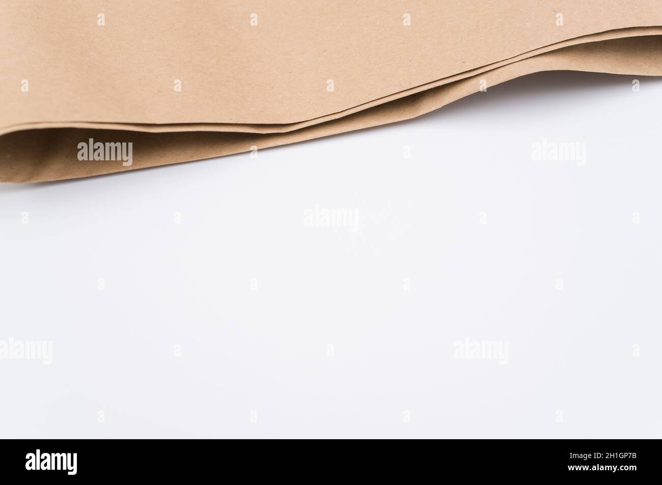 recycled brown Kraft paper folded on white background Stock Photo - Alamy