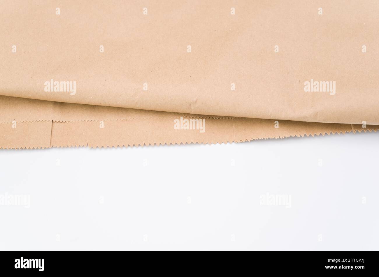 recycled brown Kraft paper folded on white background Stock Photo - Alamy