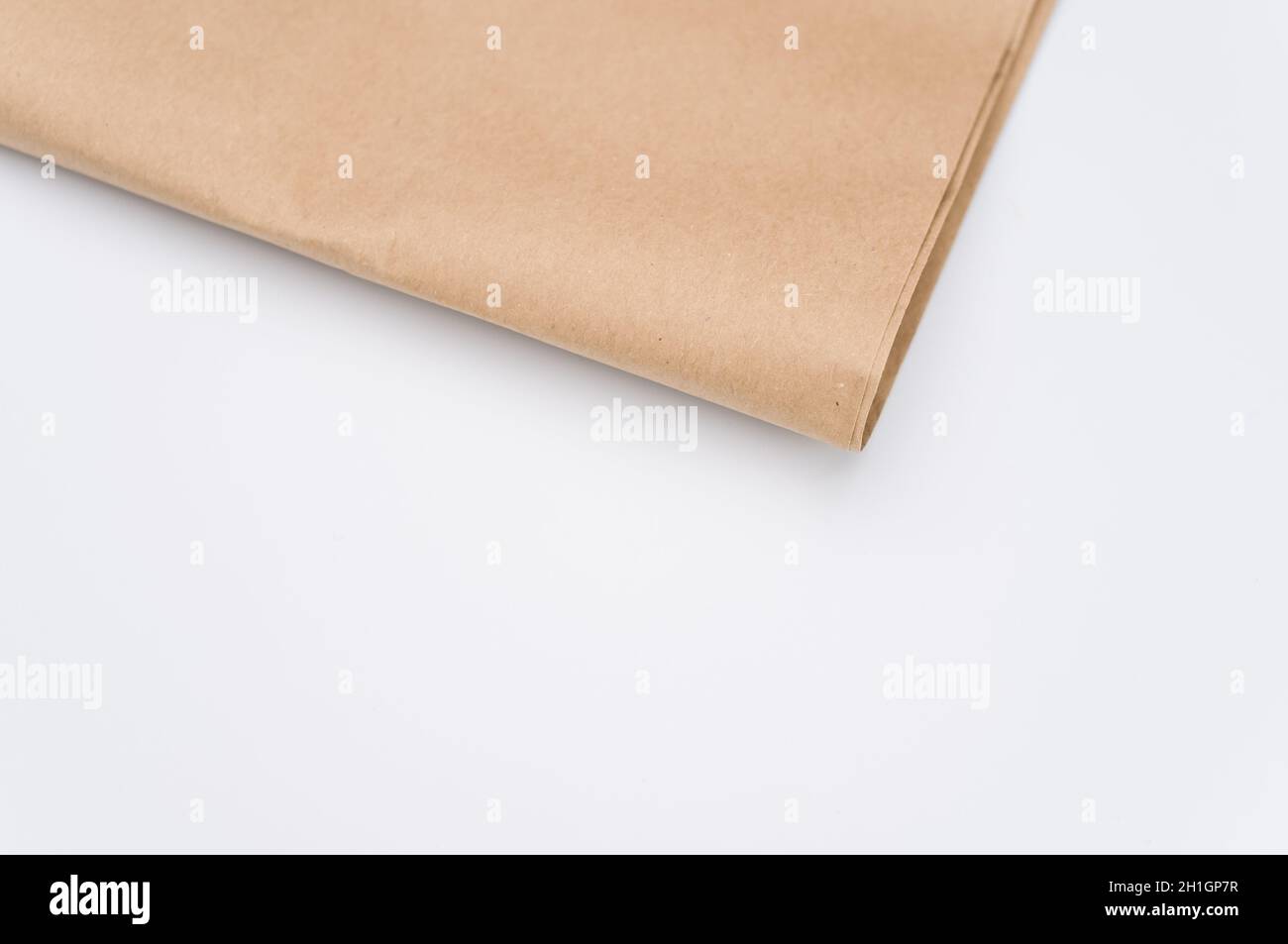 recycled brown Kraft paper folded on white background Stock Photo - Alamy