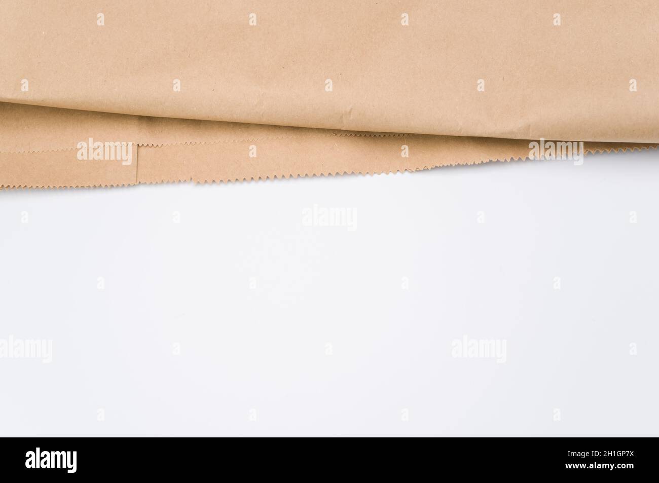 recycled brown Kraft paper folded on white background Stock Photo - Alamy