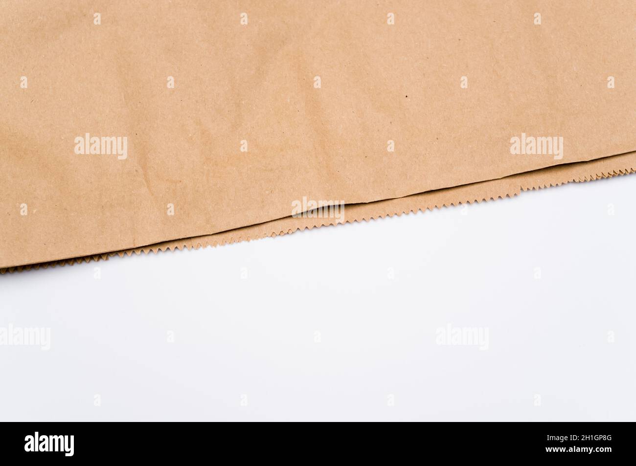recycled brown Kraft paper folded on white background Stock Photo - Alamy