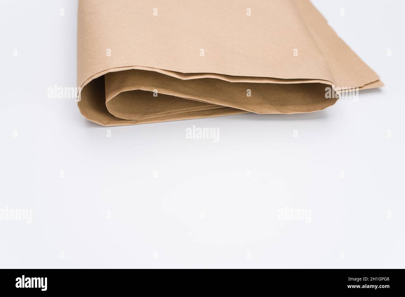 recycled brown Kraft paper folded on white background Stock Photo - Alamy