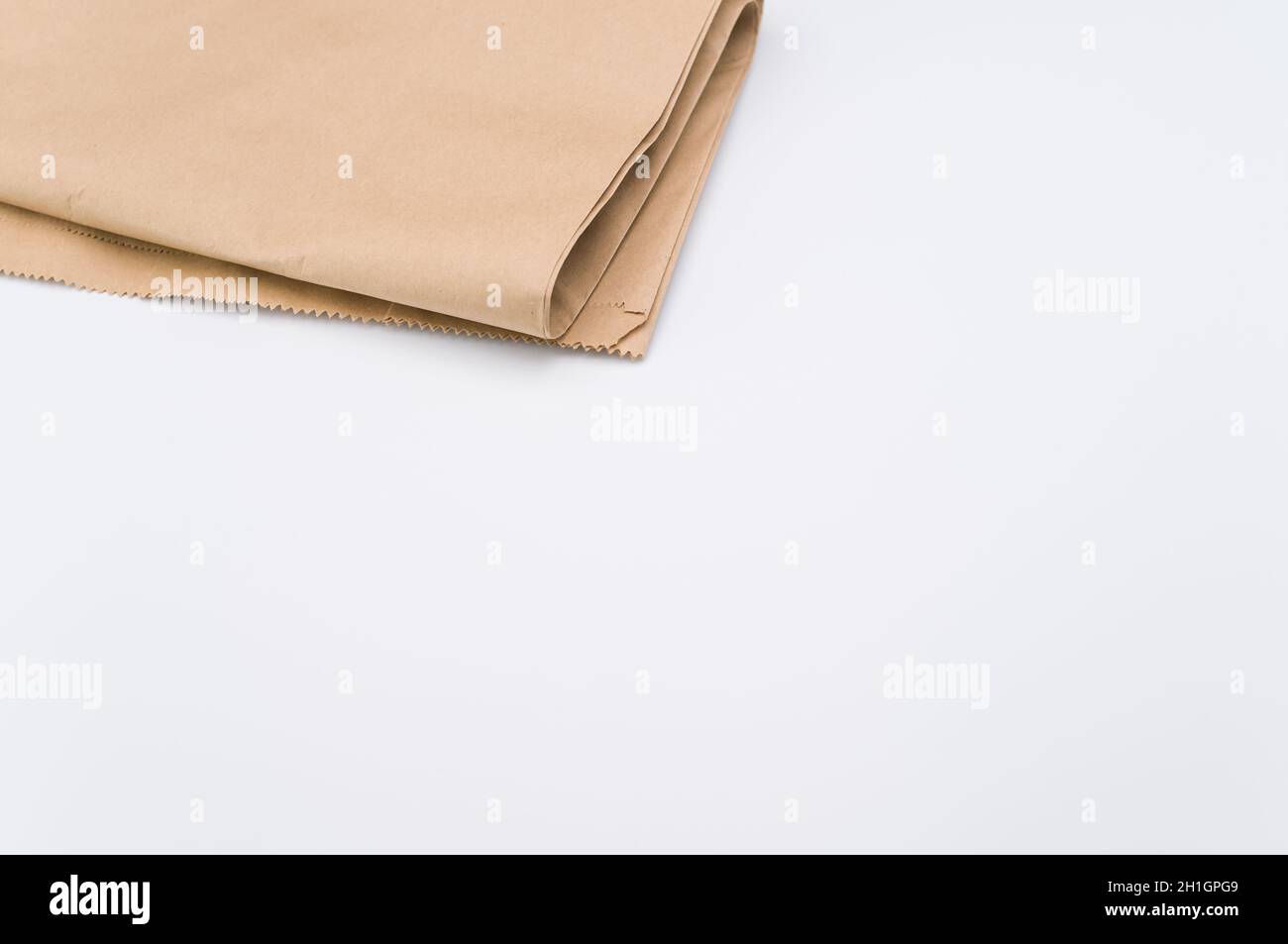 recycled brown Kraft paper folded on white background Stock Photo - Alamy