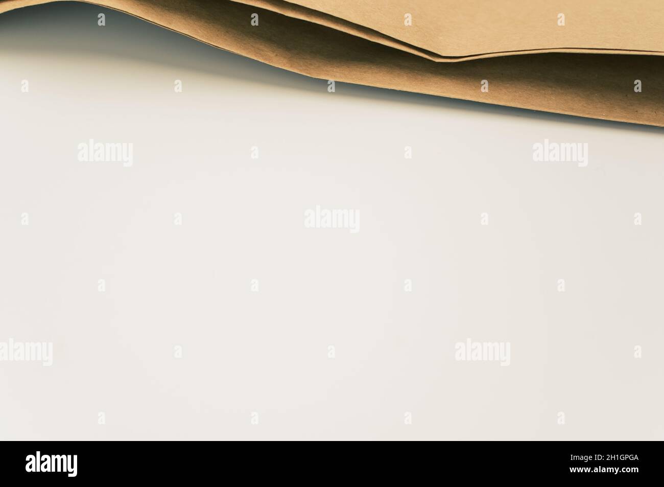 recycled brown Kraft paper folded on white background Stock Photo - Alamy