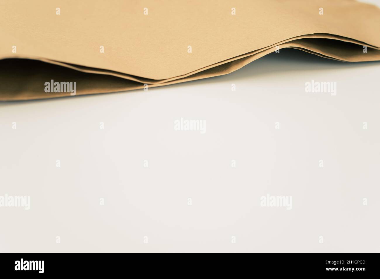 recycled brown Kraft paper folded on white background Stock Photo - Alamy