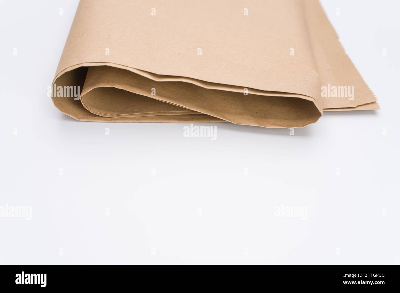 recycled brown Kraft paper folded on white background Stock Photo - Alamy
