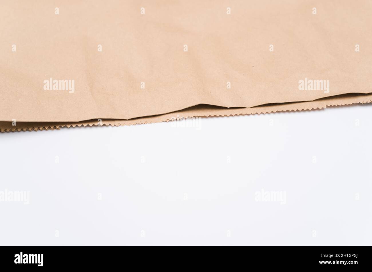 recycled brown Kraft paper folded on white background Stock Photo - Alamy