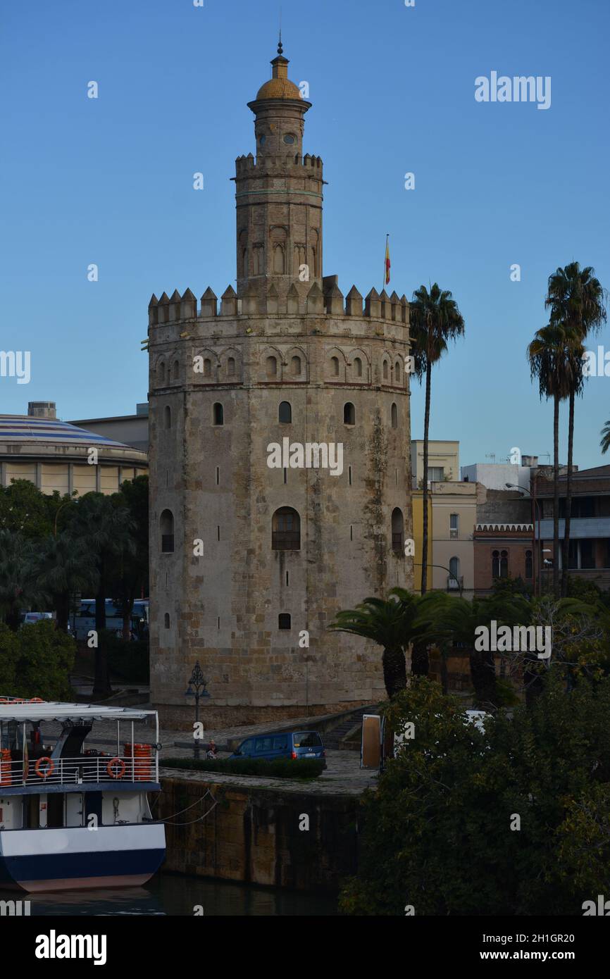 The Golden Tower in Seville. The embankment in the capital of Andalusia ...