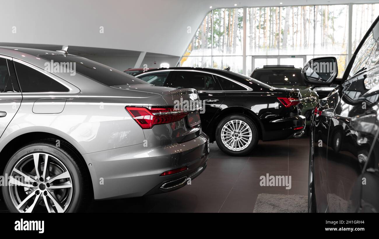Cars in the showroom, luxury cars in the interior of a car dealership ...