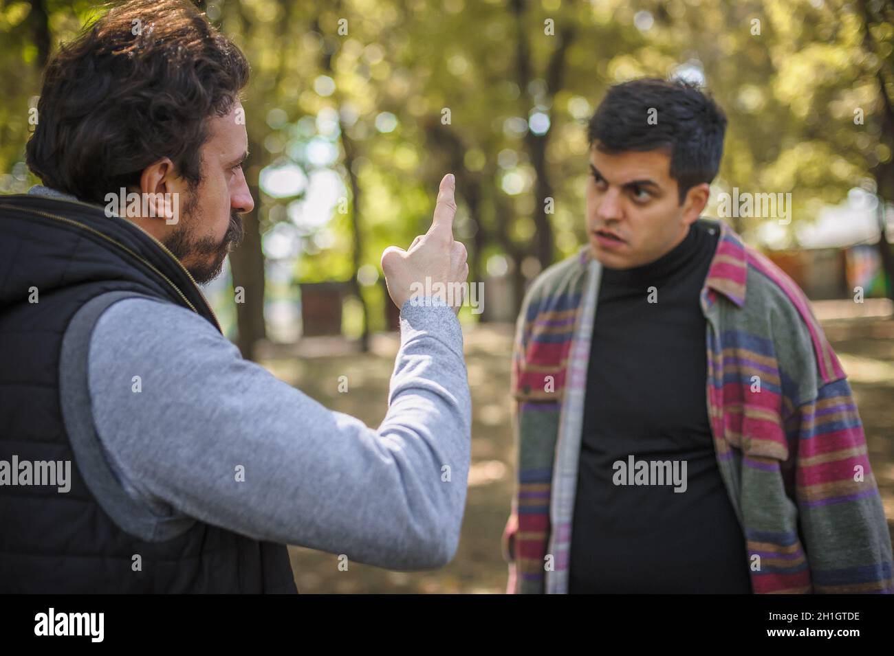 Close-up finger pointing of two very angry, nervous and upset men in an ...