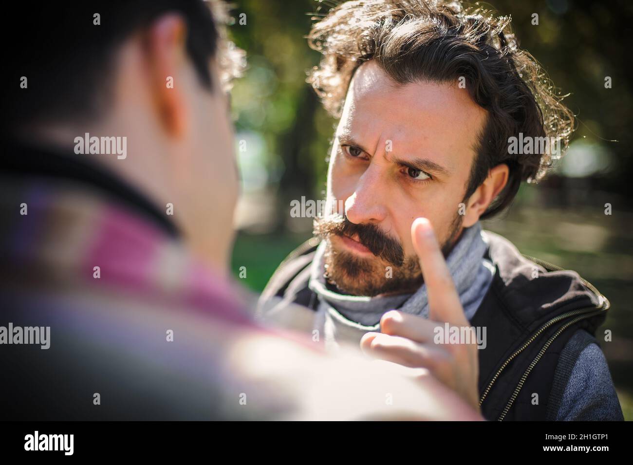 Close-up finger pointing of two very angry, nervous and upset men in an ...