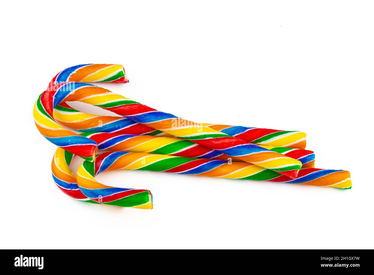Rainbow colored candy cane isolated on white background Stock Photo - Alamy