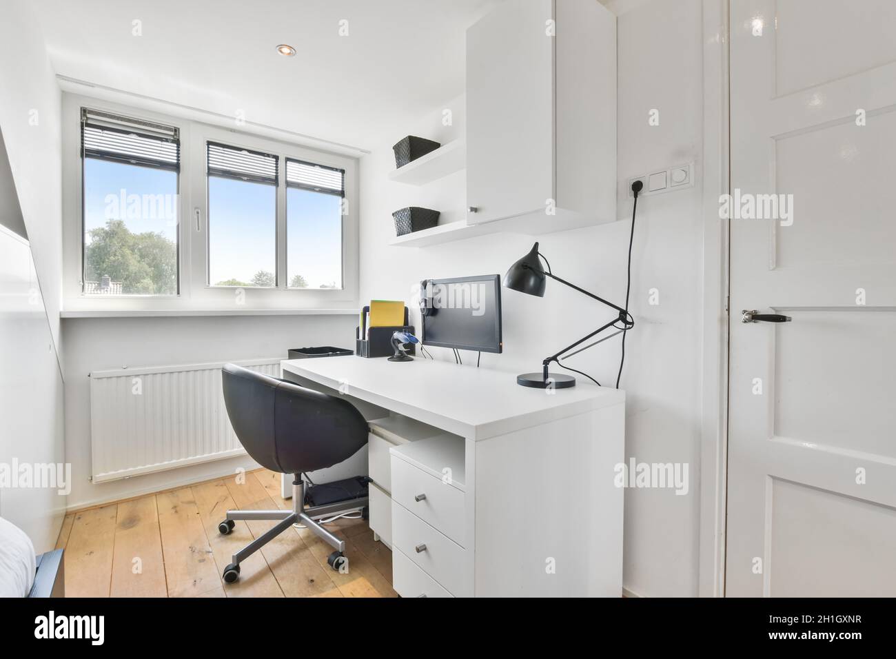 A cozy and spacious office room in a luxury design Stock Photo - Alamy