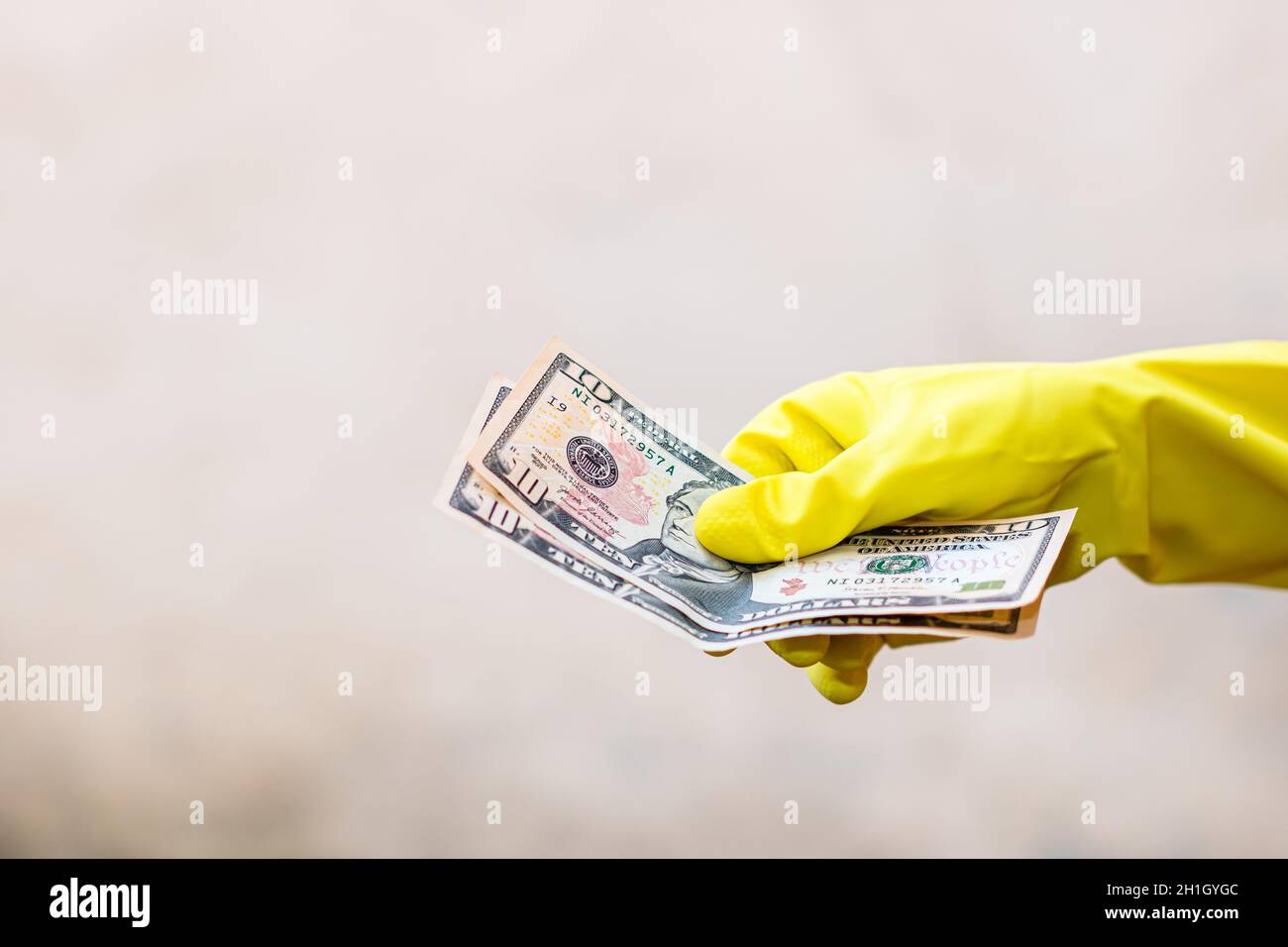 Hand with gloves receiving, giving or holding USD EURO banknote. World ...