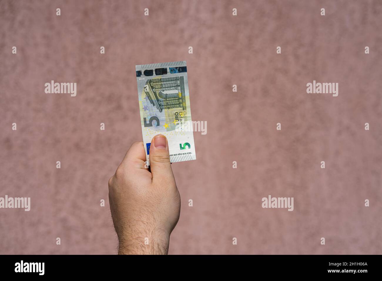 Hand holding showing euro money and giving or receiving money like tips ...