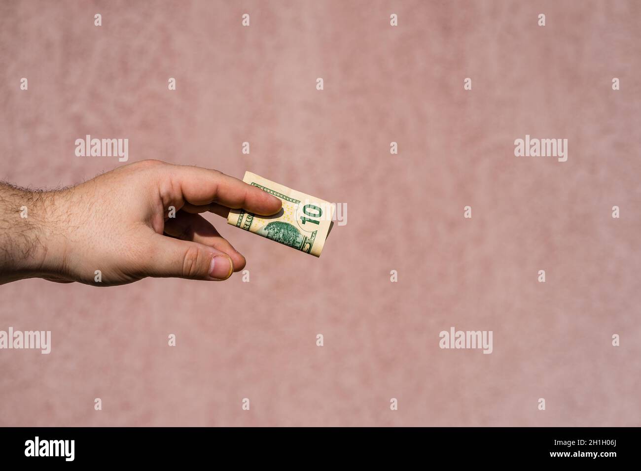 Hand holding showing dollars money and giving or receiving money like ...