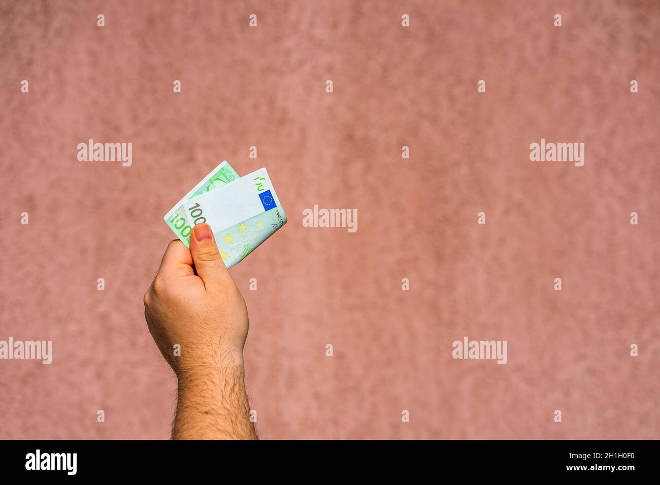 Hand holding and showing euro money or giving money. World money ...