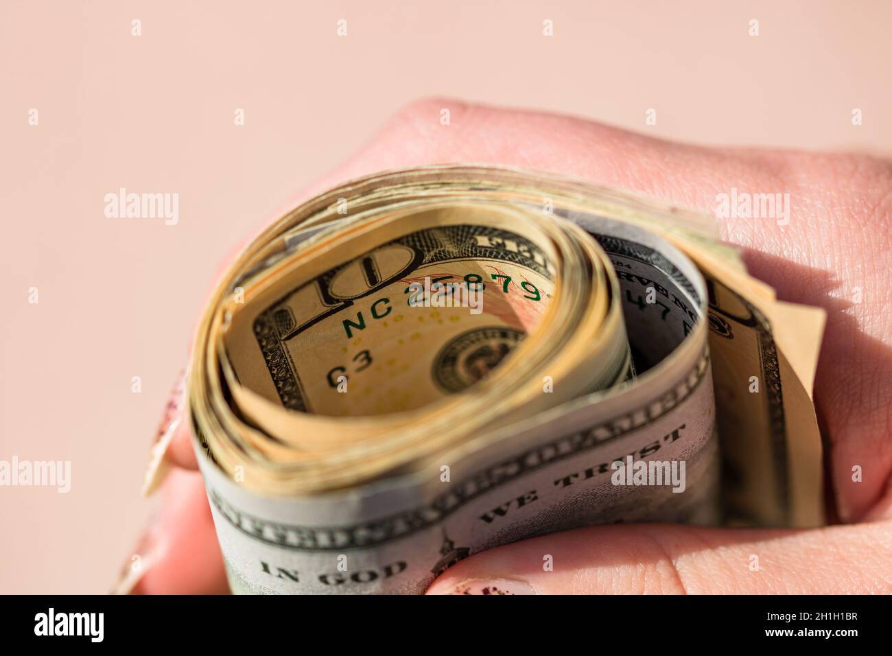 Selective focus on detail of USD banknotes. Counting or giving United ...