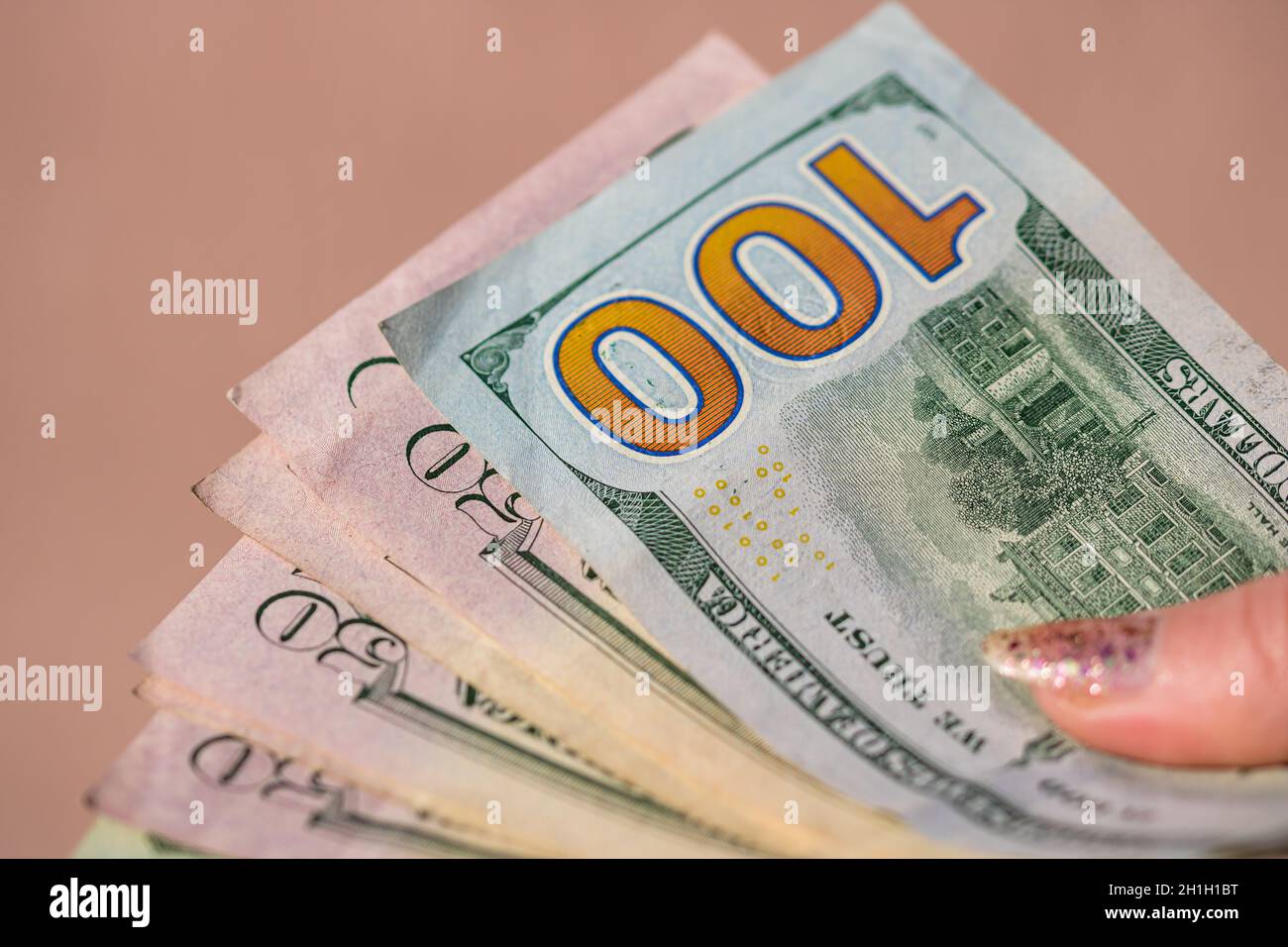 Selective focus on detail of USD banknotes. Counting or giving United ...
