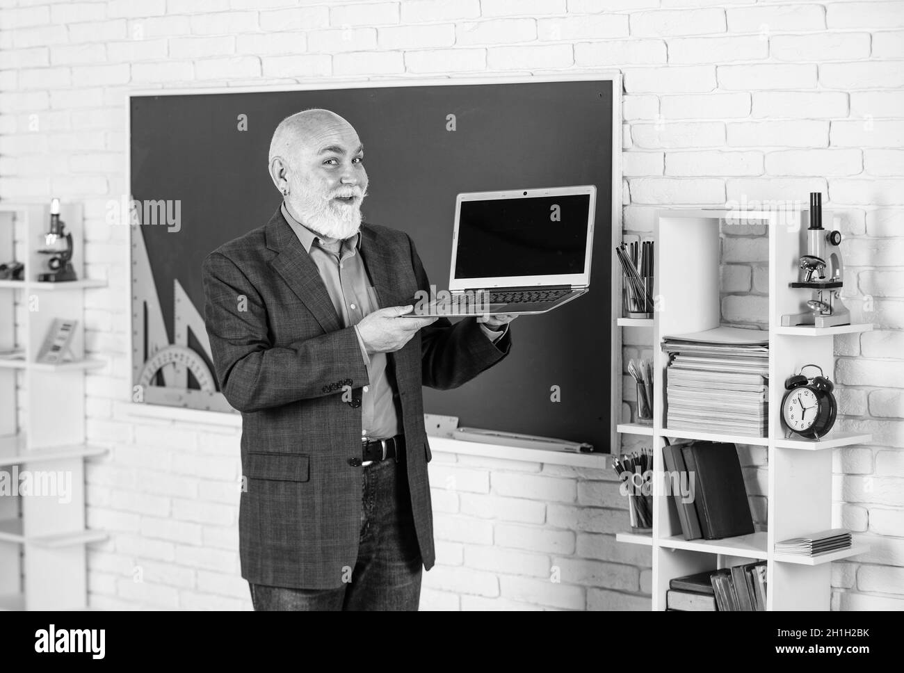 social network. IT-teacher use laptop at lesson. new technology in ...