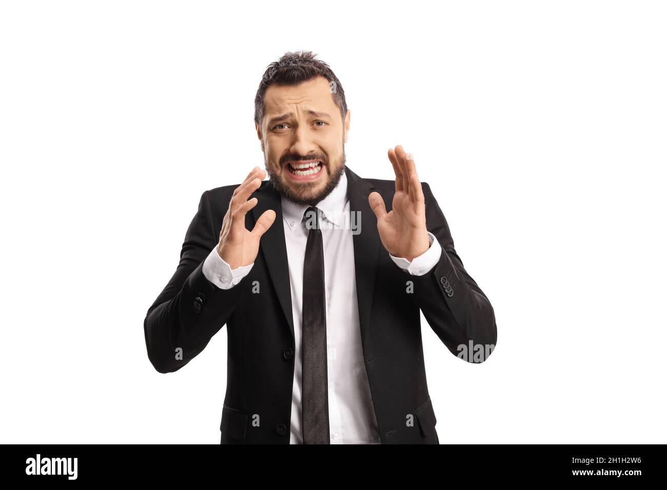 Scared businessman making a grimace and gesturing with hands isolated ...