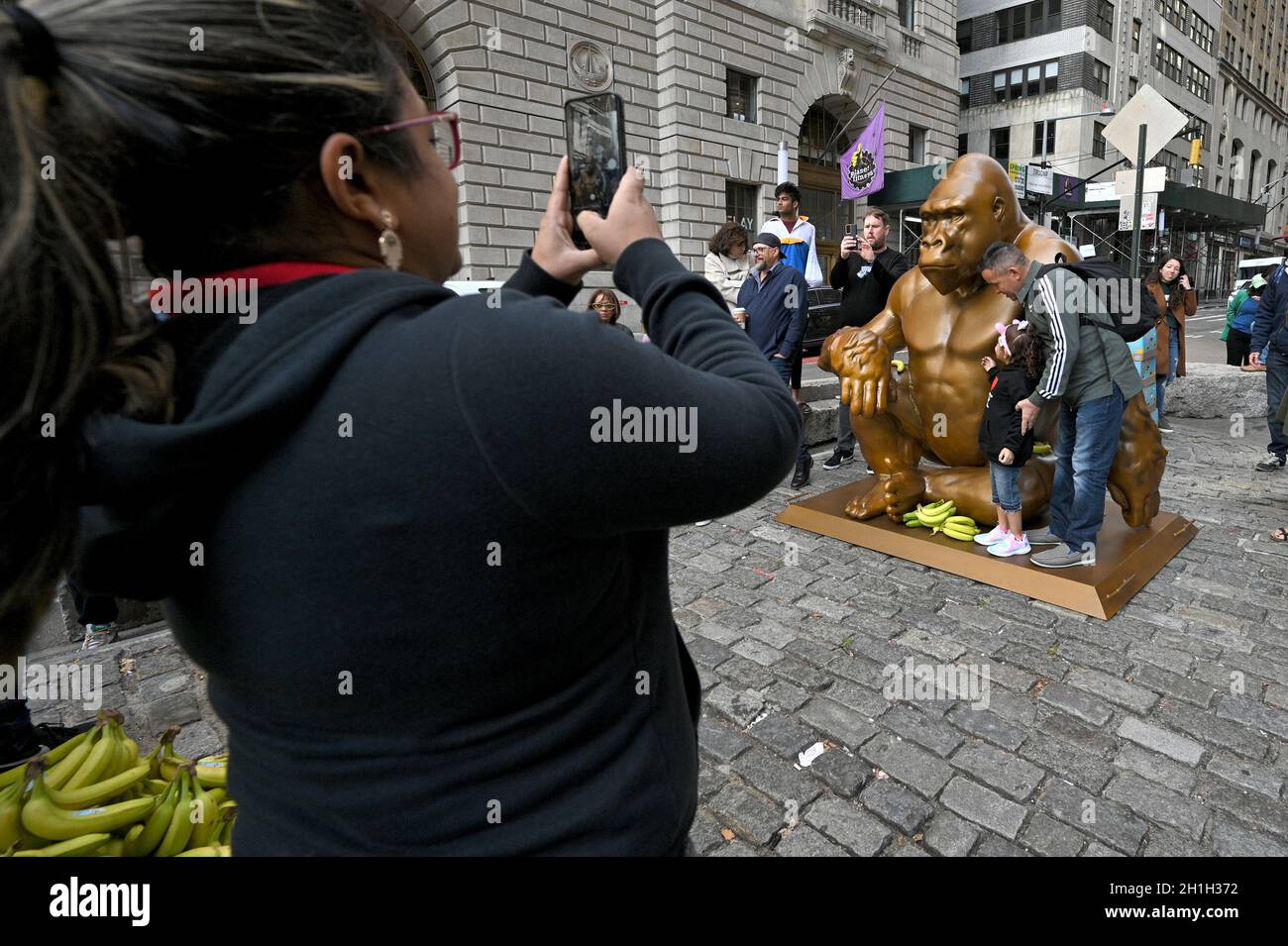New York, USA. 18th Oct, 2021. People poses alongside a temporary ...