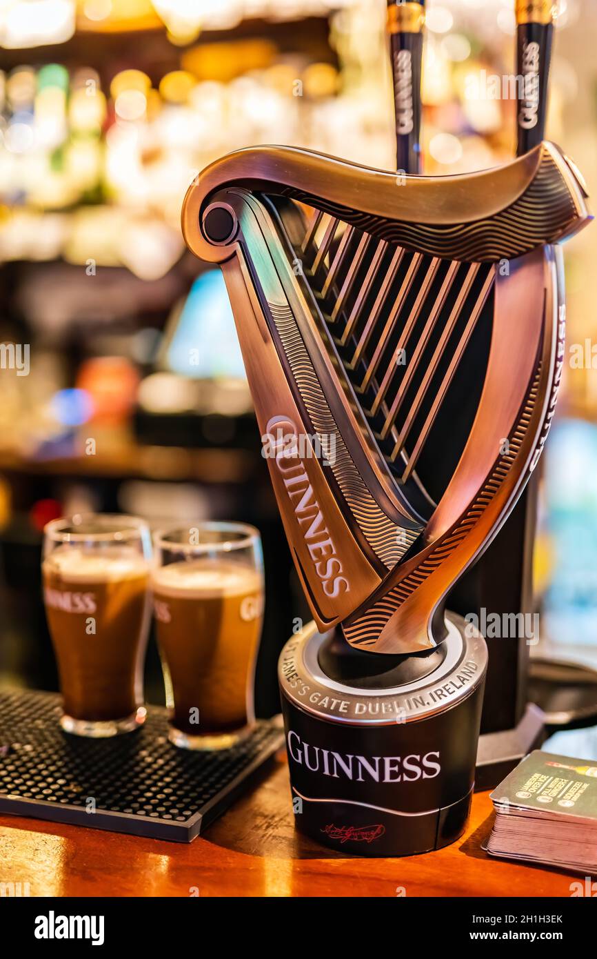 Dublin, Ireland, August 2018 Selective focus on Guinness tap with ...