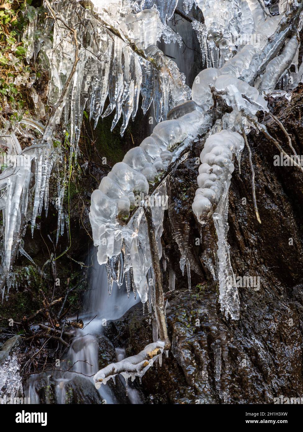 sculptures of Ice hanging over a waterfall Stock Photo - Alamy
