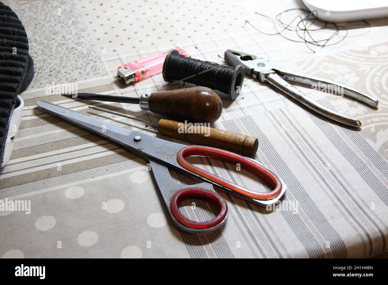Shoemaker crafting tools set on table Stock Photo - Alamy