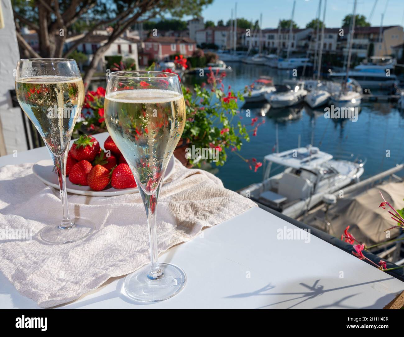 Summer party, pouring of French brut champagne sparkling wine in ...
