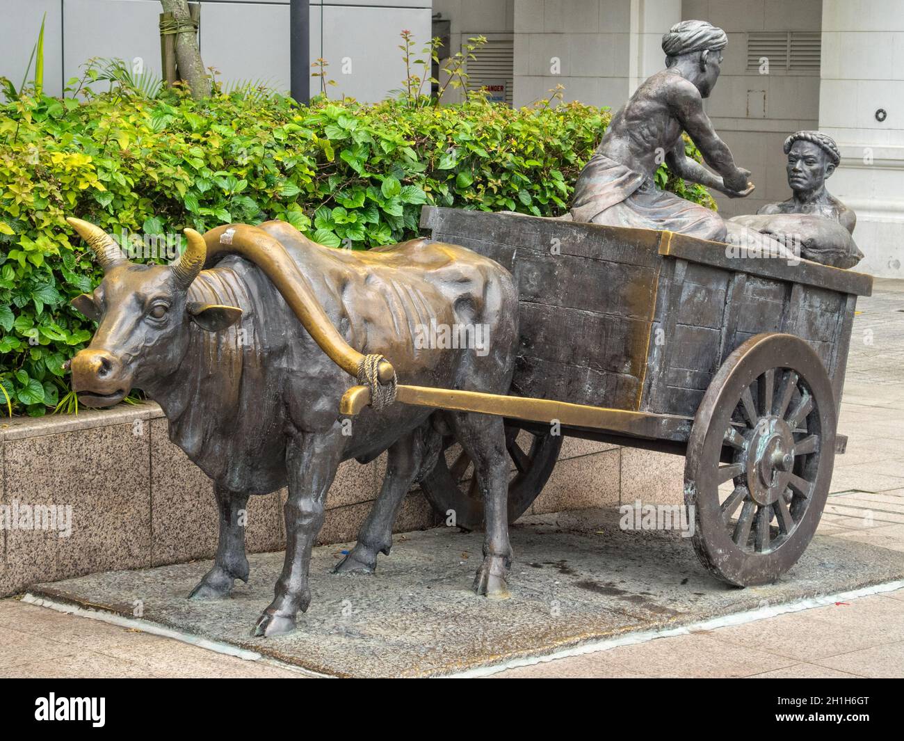 River Merchants, a bronze sculpture by Aw Tee Hong along the Boat Quay ...