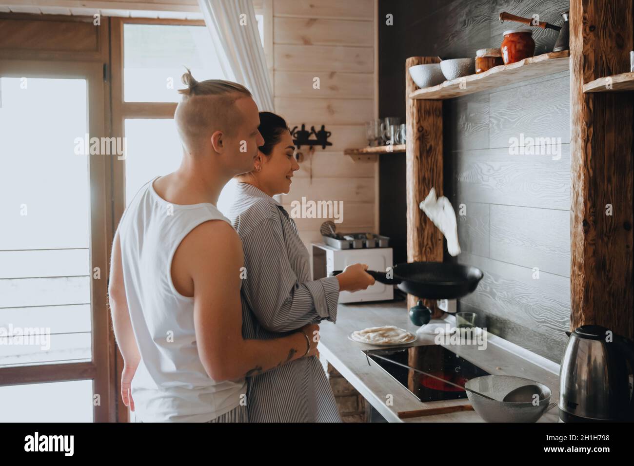 Two friends cooking together home hi-res stock photography and images ...