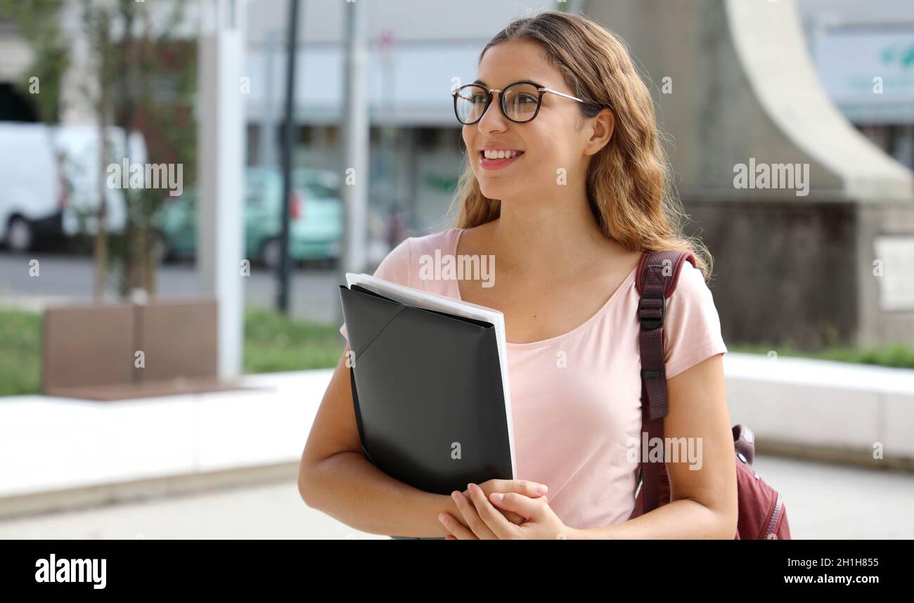 Happy beautiful student goes back to school Stock Photo - Alamy