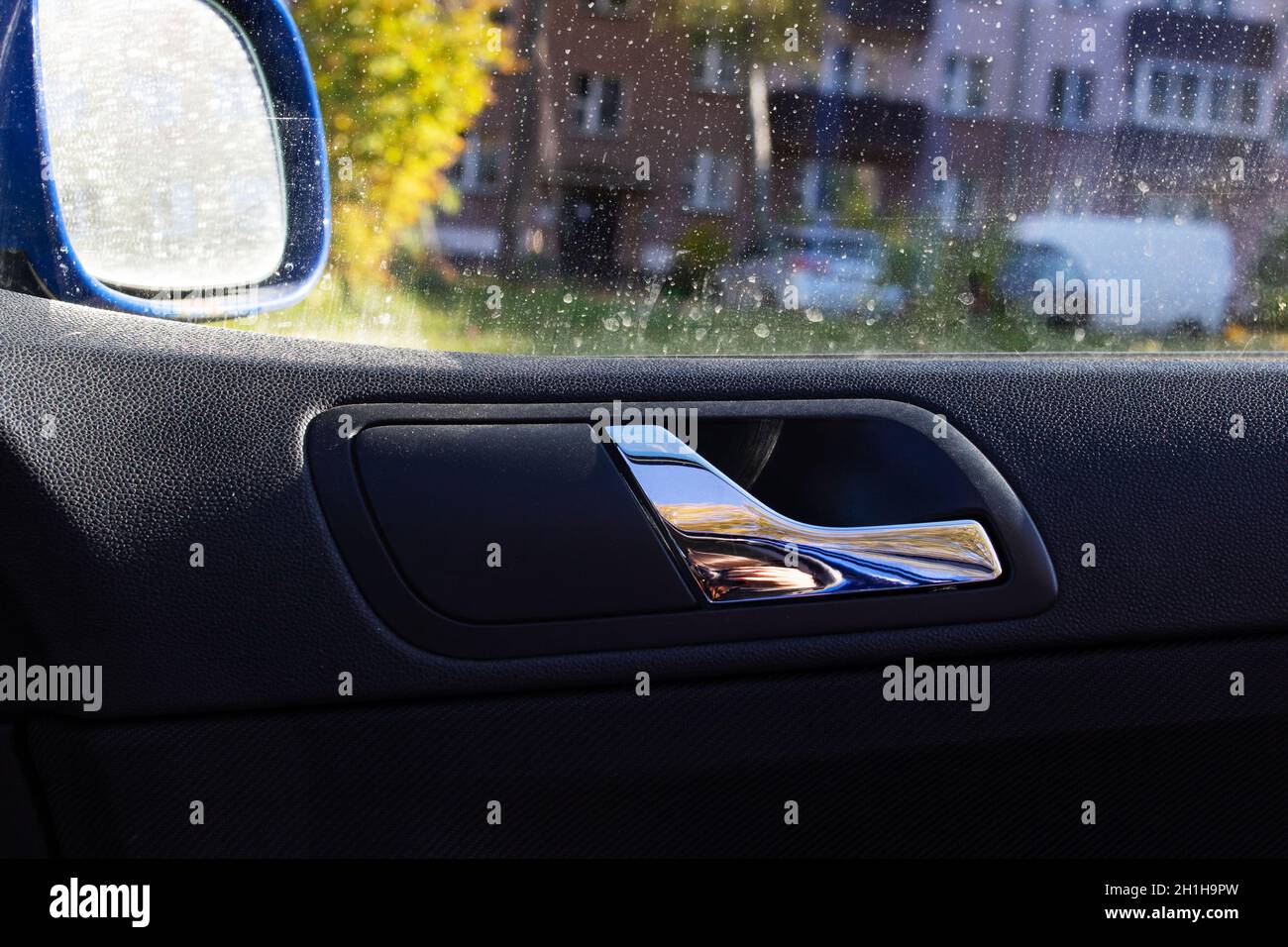 Car door opening handle from the inside close up Stock Photo - Alamy