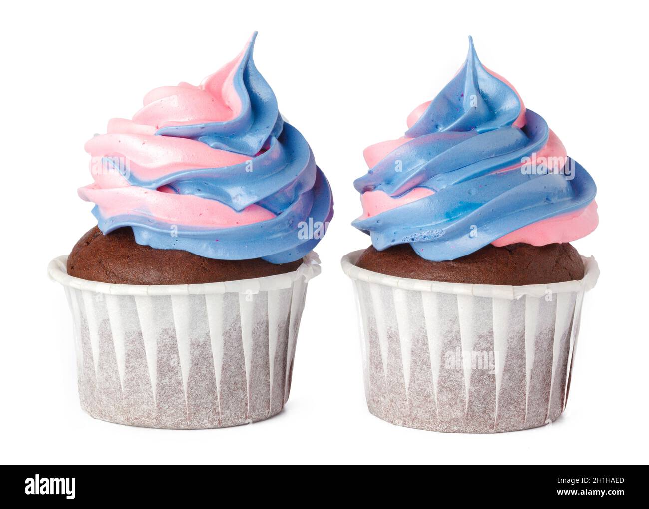 Two cupcakes isolated on white background close up Stock Photo - Alamy