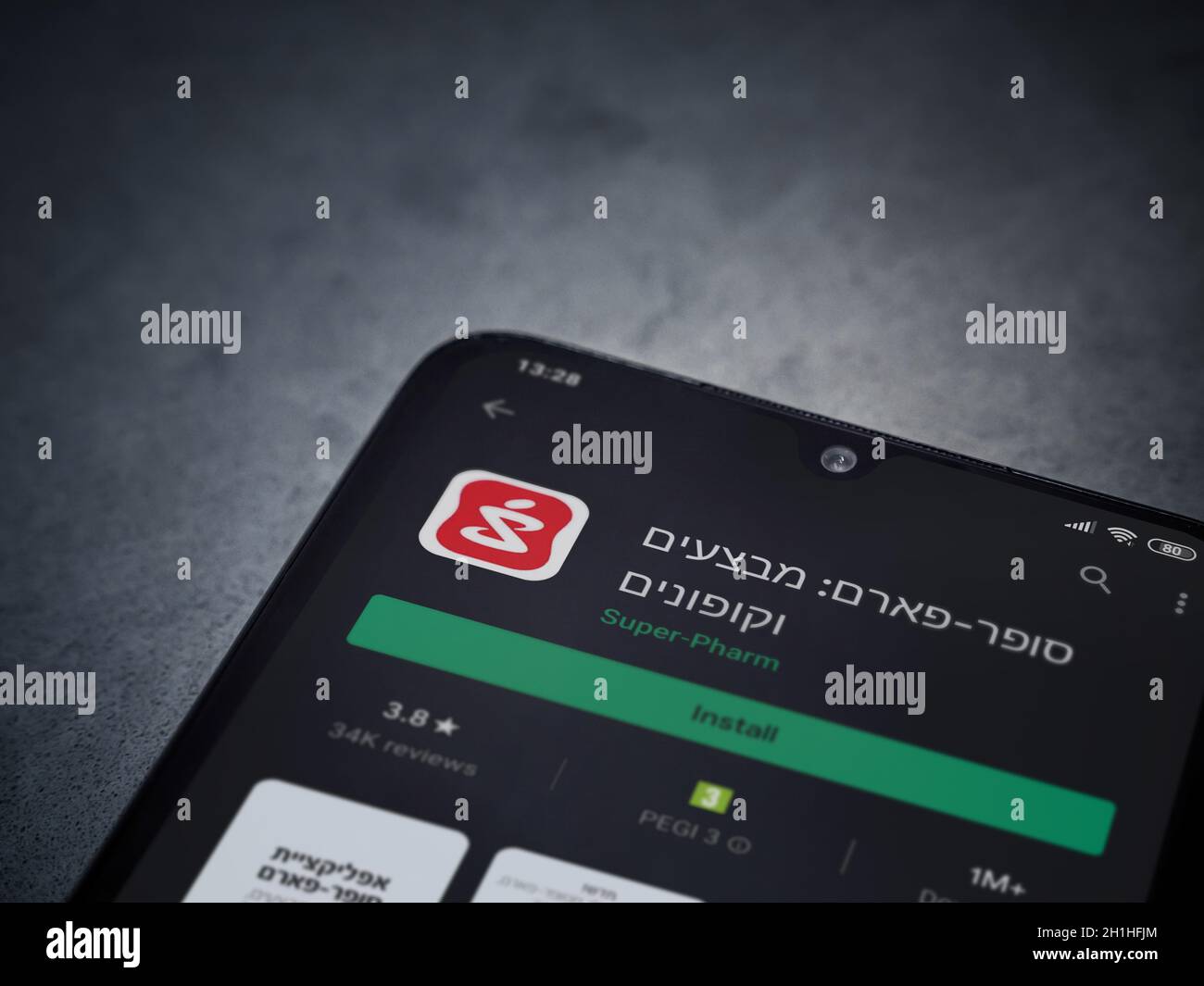 Lod, Israel - July 8, 2020: Super Pharm app play store page on the display of a black mobile ...