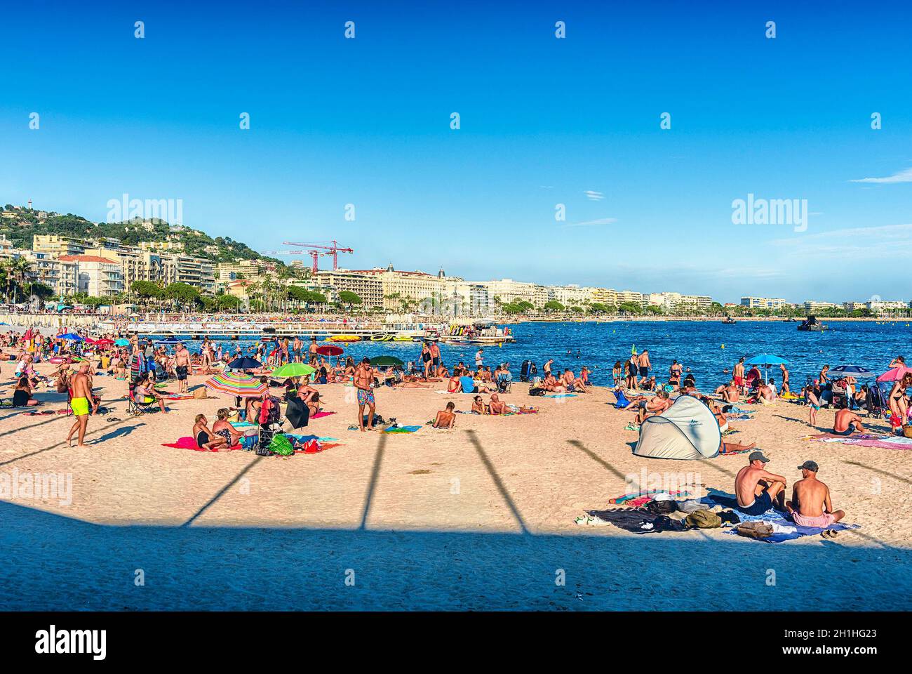 CANNES, FRANCE - AUGUST 15: People enjoying a sunny day on the beach in ...
