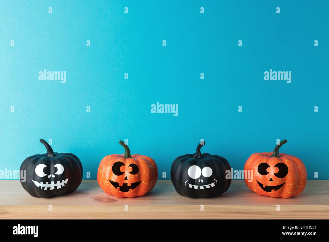 Halloween pumpkin decor with funny faces. Creative Halloween minimal ...